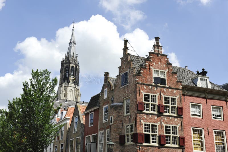 Church and houses in Delft stock image. Image of gable - 15216571