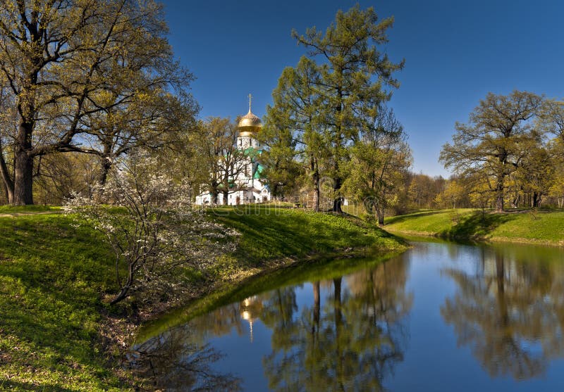 Church and pond in spring stock image. Image of sunny - 50714739
