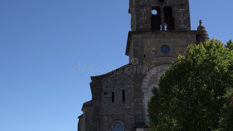 Church in Shadow with Trees in Sunshine and Blowing in the Wind Stock ...