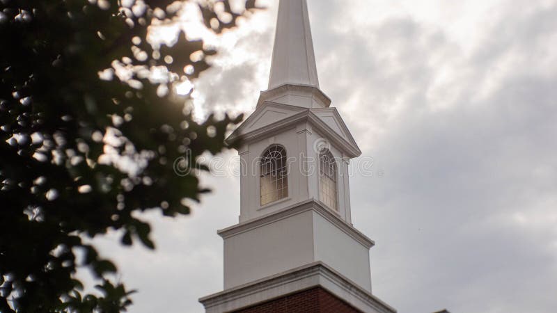 Church Steeple Against a Cloudy Daytime Sky, in the Background of ...