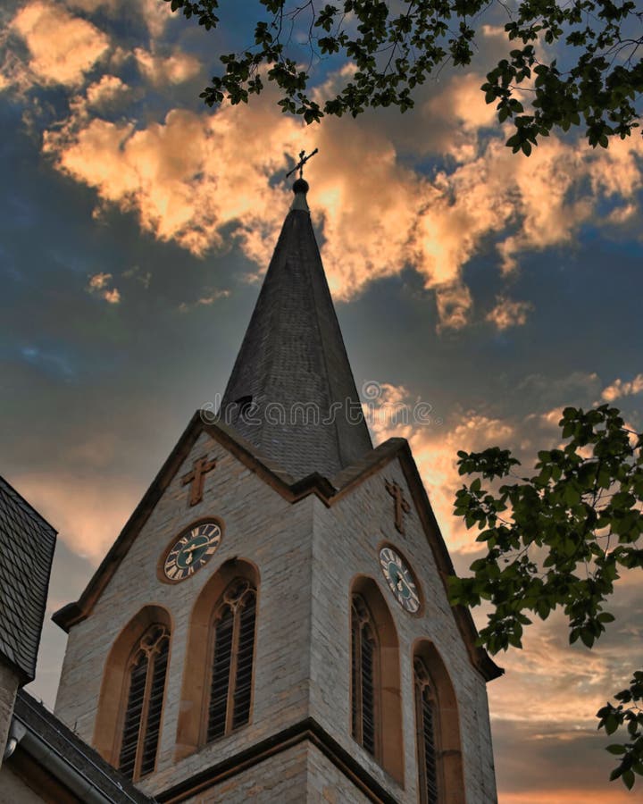 Church tower at sunset stock photo. Image of landmark - 220196532