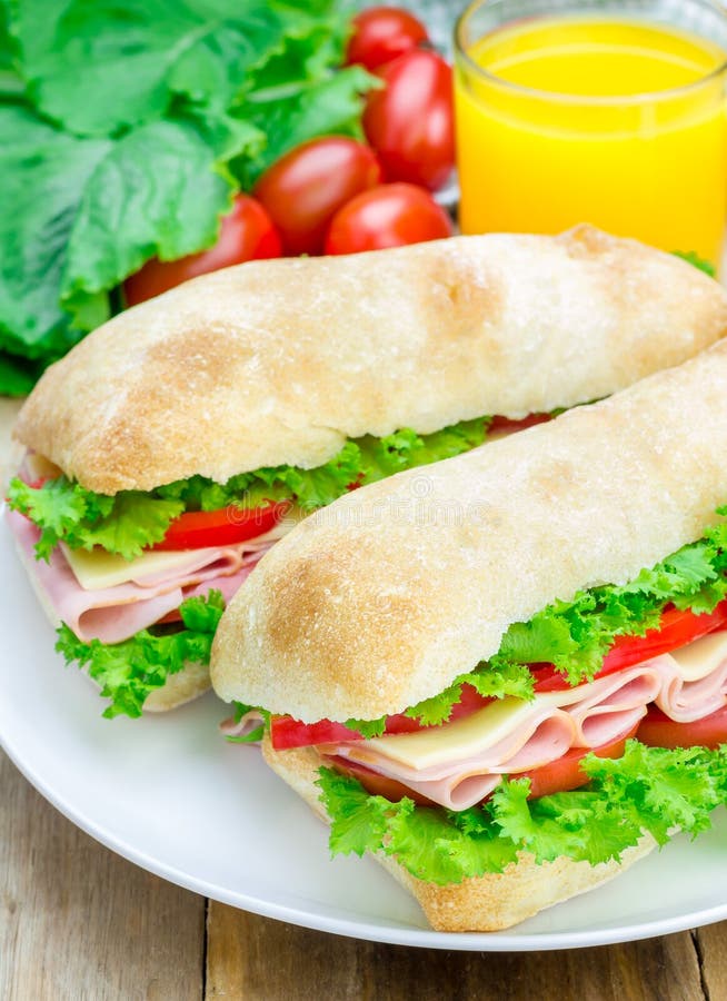 Ciabatta Bread Sandwiches with Ham and Cheese on the White Plate Stock ...