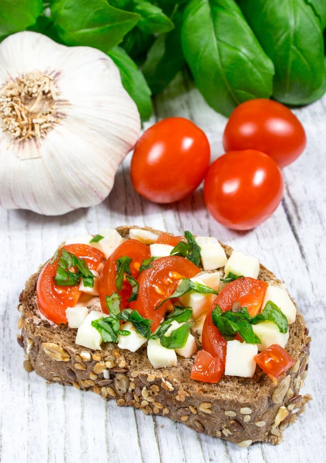 Ciabatta Bread with Tomatoes, Mozzarella and Basil. Stock Photo - Image ...