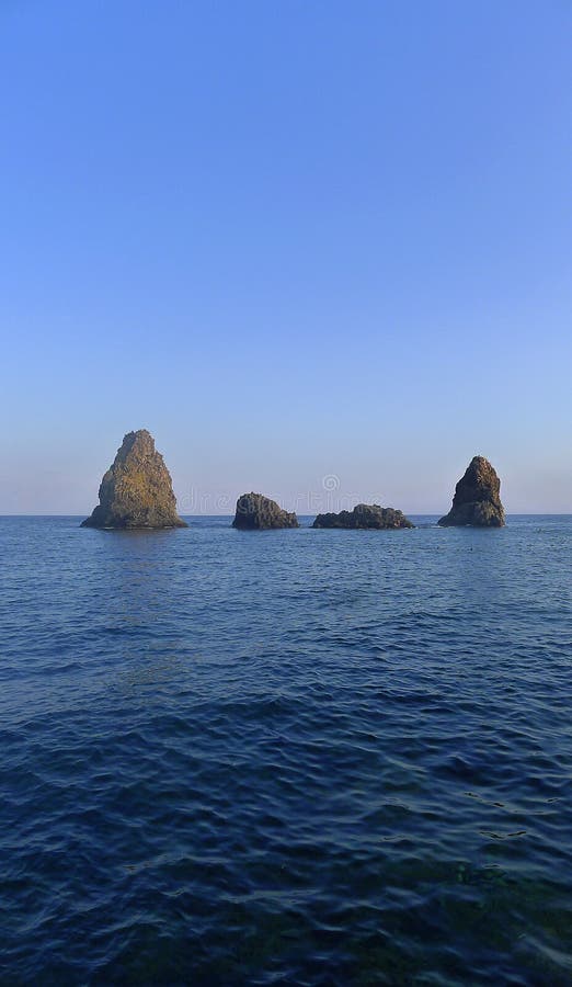 Ciclopi Rocks, Acitrezza, Sicily Stock Photo - Image of lido, mith ...