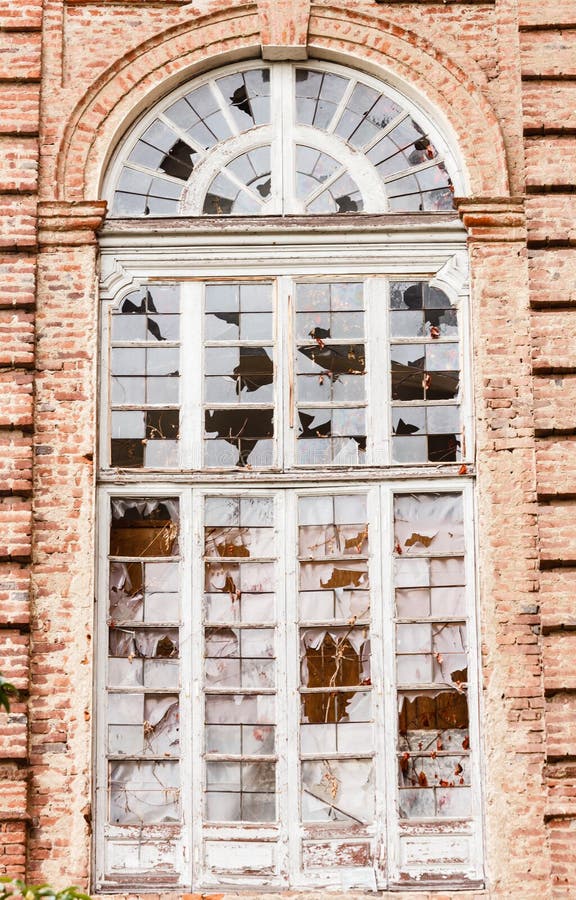 A Large Window Full of Broken Glass Stock Photo - Image of damage ...