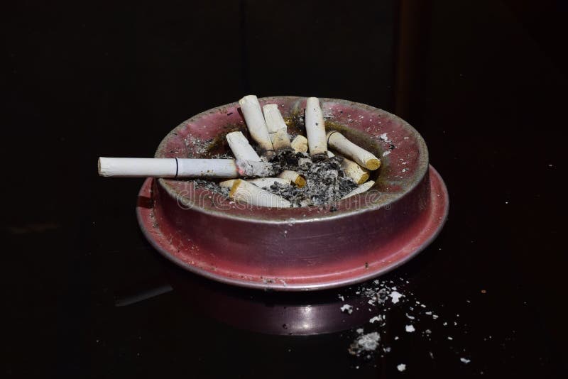 Cigarette in an ashtray stock image. Image of close - 138426389