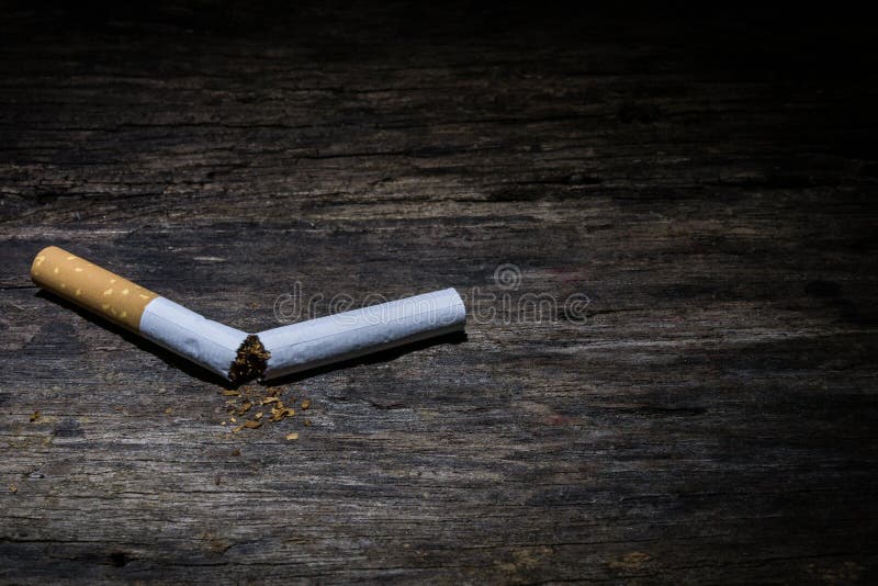 Cigarette break on wood. stock photo. Image of break - 69278438