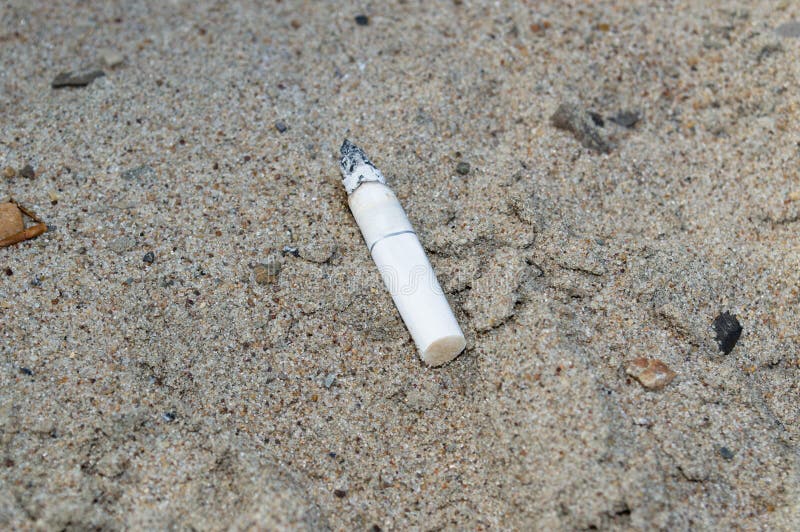Cigarette stock photo. Image of cigarette, habits, sand - 84717688