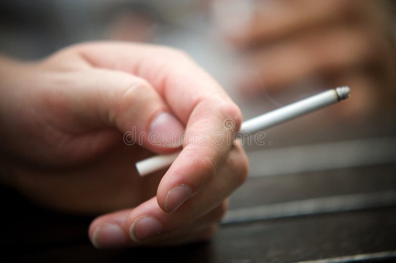 Cigarette in hand stock image. Image of concept, smoke - 7597979