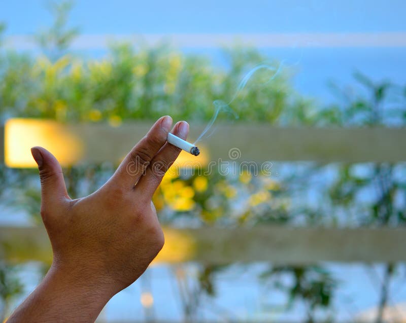 Cigarette in hand stock image. Image of black, care, addiction - 85108075