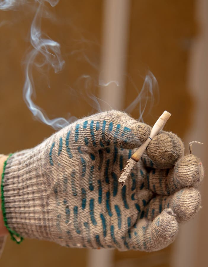 Cigarette in the Hand of a Worker at a Construction Site Stock Photo ...