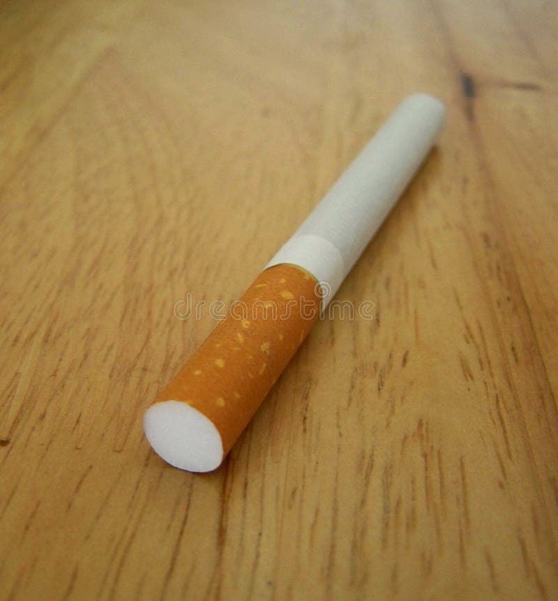 Cigarette lying idle stock image. Image of table, habit - 6438911