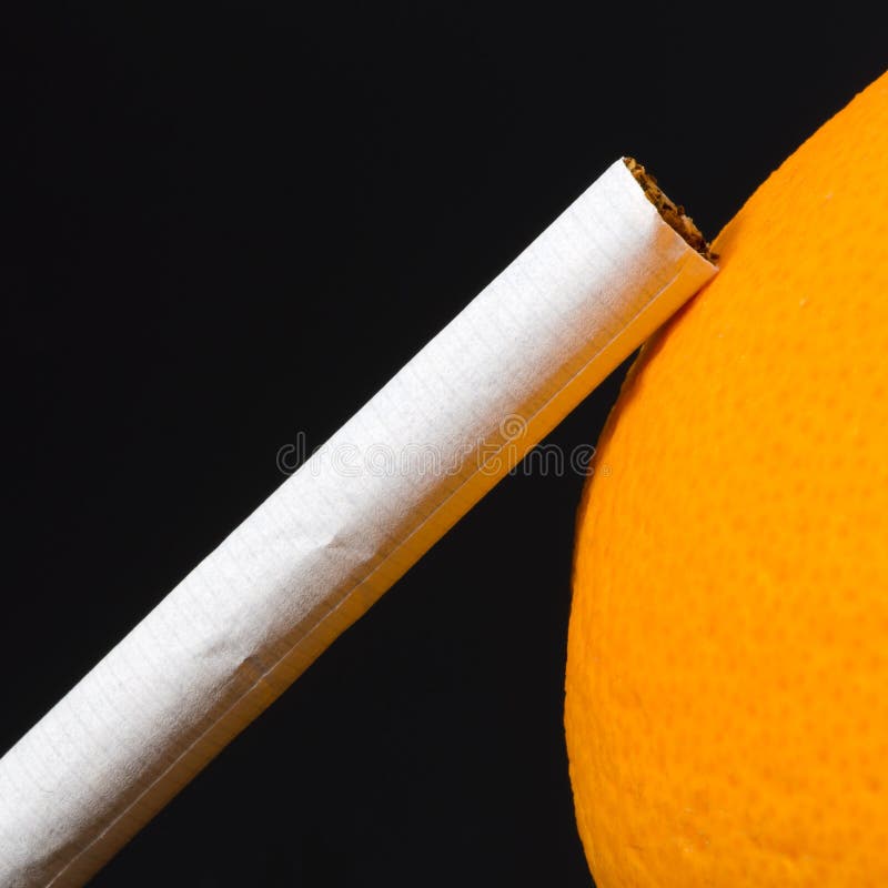 Cigarette and orange stock photo. Image of fruit, design - 44537436