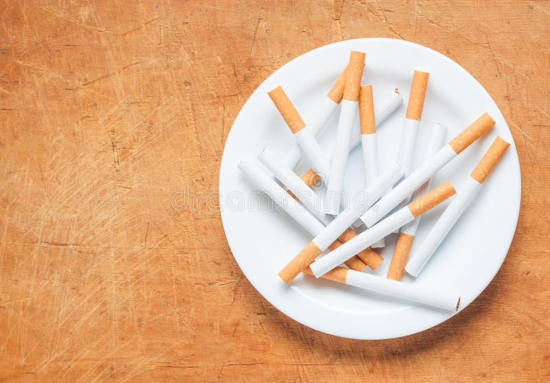 Cigarette on a Plate Top View Stock Photo - Image of deadly ...
