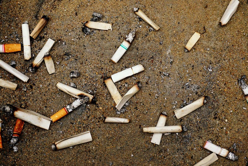 Cigarette stub on sand stock image. Image of pollute - 57905463