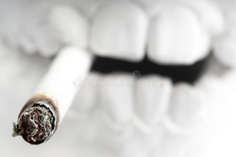 Cigarette in the teeth stock photo. Image of risk, teeth - 28217828