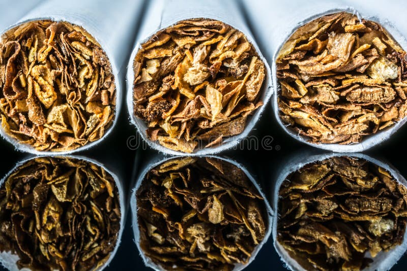 Cigarette Macro with a Tobacconist with a Reflection in a Black Glass ...