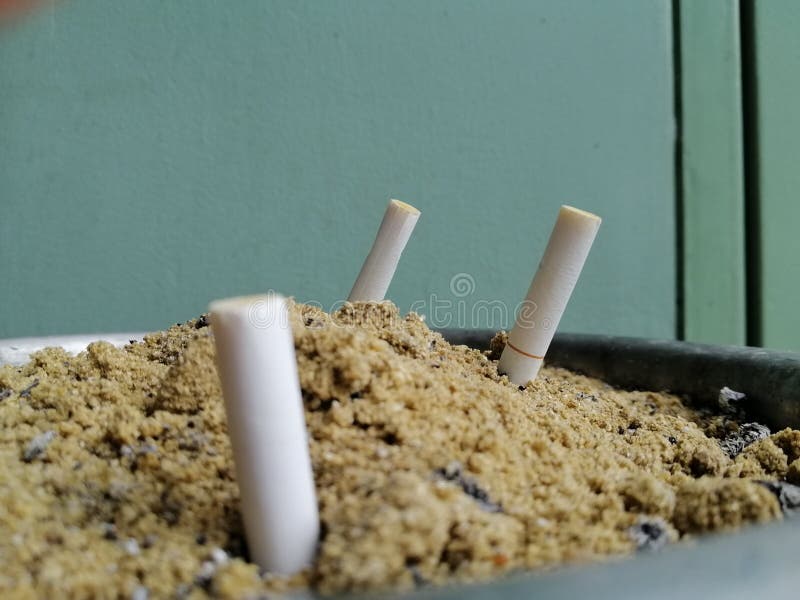 Cigarettes Buttâ€‹ Drip in Sand. Stock Photo - Image of cake, dessert ...