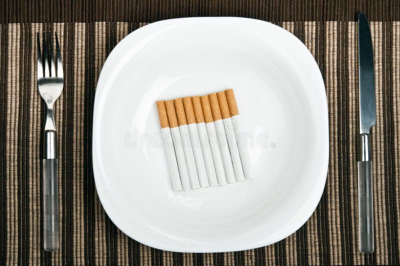 Cigarette On Dinner Plate stock image. Image of background - 29846315