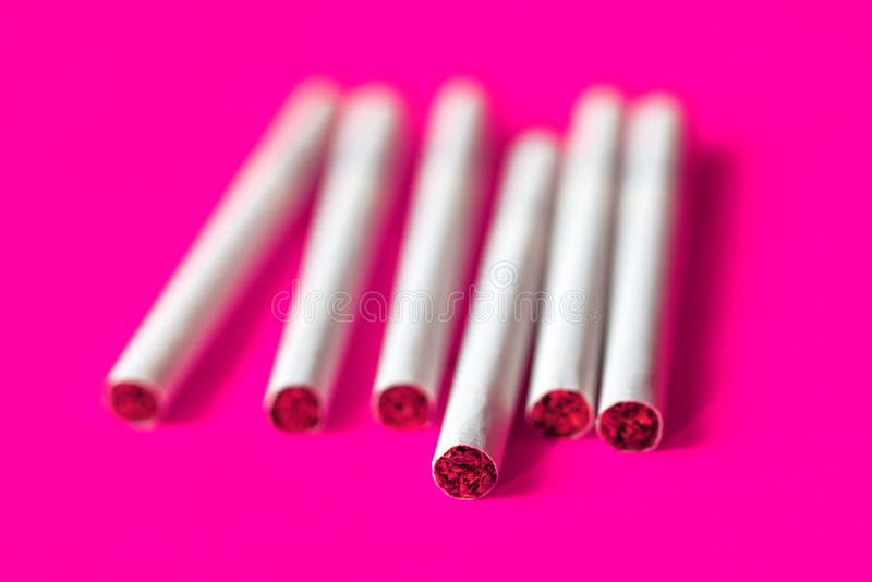 Cigarettes in pink light stock photo. Image of dangerous - 224001768