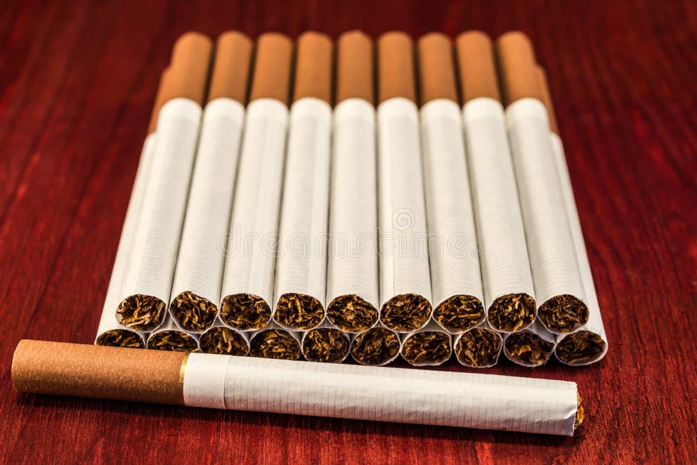 Cigarettes on the table stock image. Image of bunch - 240186223