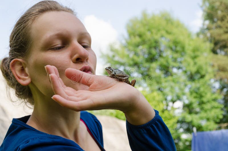 Cinderella Kissing Little Frog on Palm Stock Photo - Image of face ...