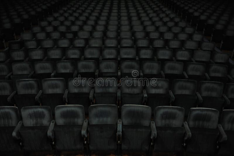Red seats in dark cinema stock image. Image of presentation - 34961595