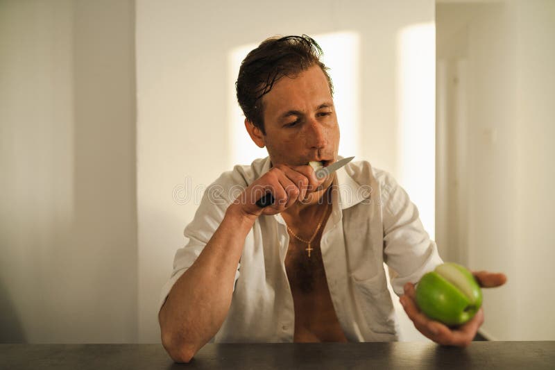 Portrait of Handsome Man Cutting and Eating Apple Stock Photo - Image ...