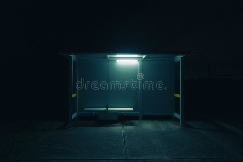 Cinematic Shot of an Empty Bus Stop at Night with a Light on Stock ...