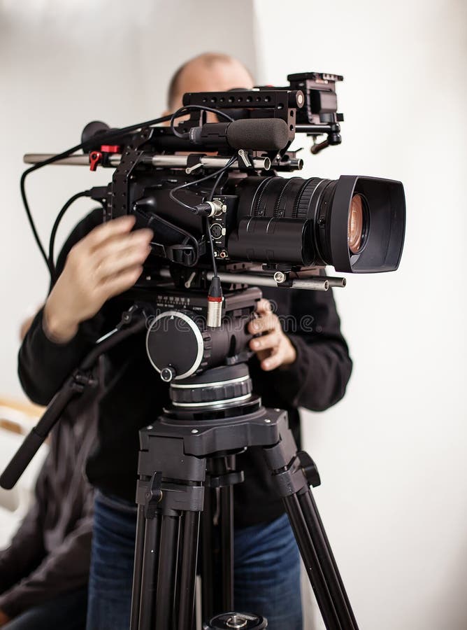 Behind The Scene. Cameraman Shooting Film Scene With His Camera Stock ...