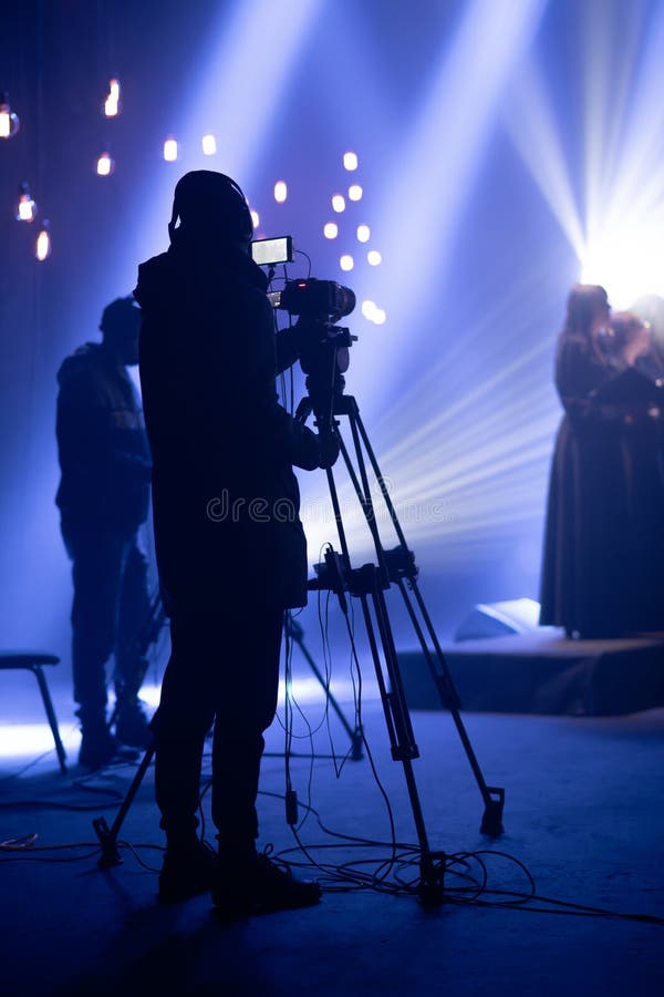 Cinematographer Filming a Stage Performance in a Studio with Dramatic Lighting. Stock Image ...