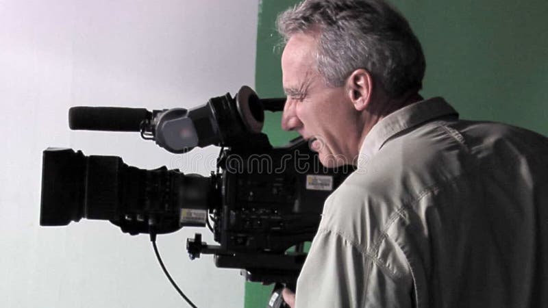 Cinematographer at work stock footage. Video of film - 55311234
