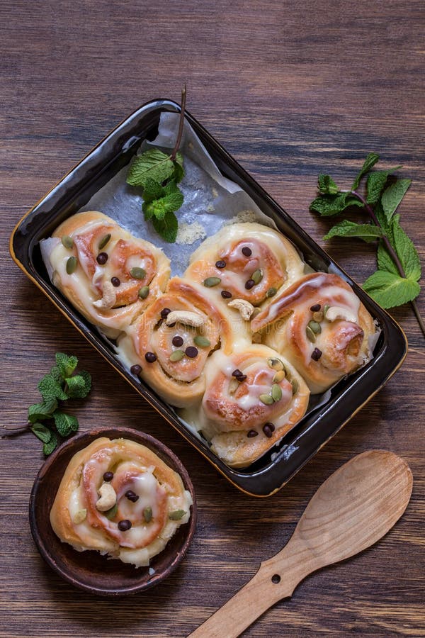 Cinnabon with Cream Cheese, Cashews and Chocolate Chips Stock Image ... Cinnabon with Cream Cheese, Cashews and Chocolate Chips Stock Image ...