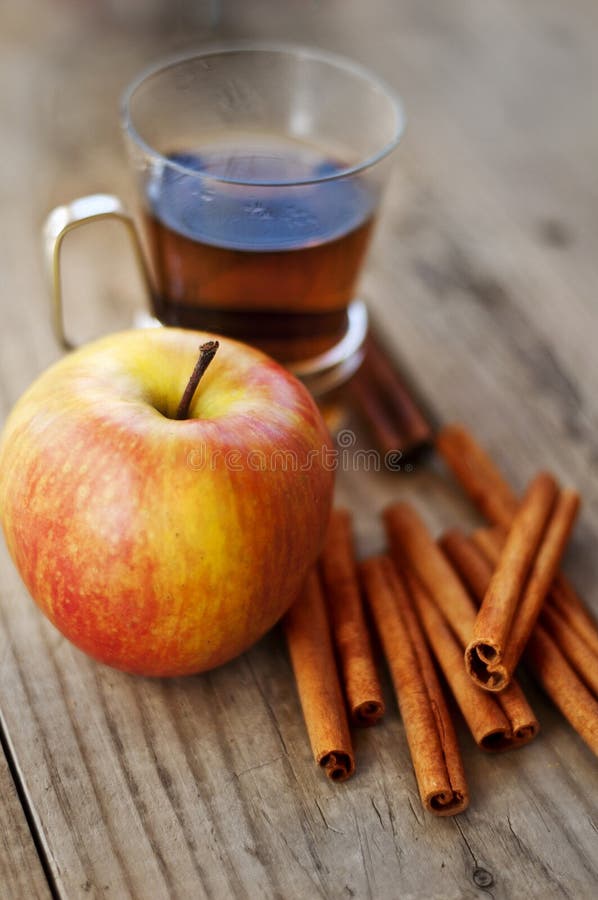 Cinnamon and apple juice stock photo. Image of background - 64782630