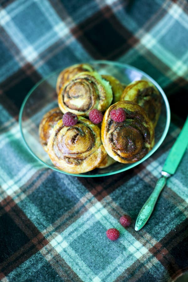 Cinnamon Buns Cooked at Home and Decorated with Raspberries Stock Image ...