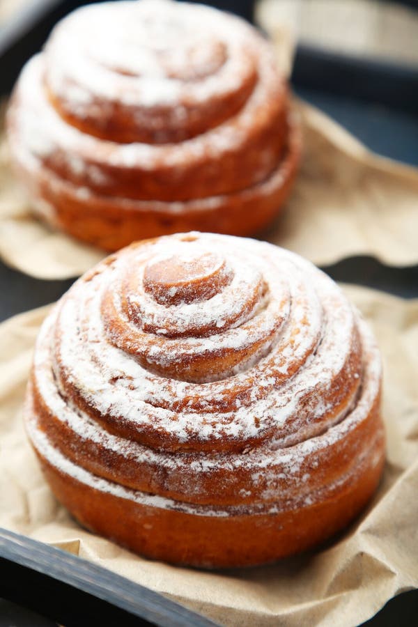 Cinnamon Buns on Paper in the Blue Tray Stock Image - Image of roll ...