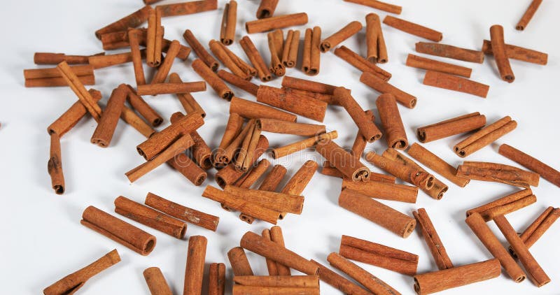 Cinnamon, Cinnamomum Zeylanicum, Spice Falling Against White Background ...