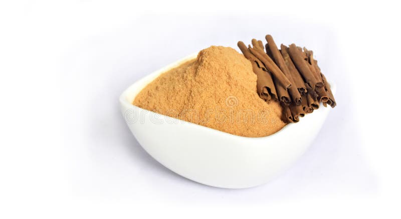 Cinnamon Dust and Sticks in Cup with Cinnamon Leaves Stock Photo ...