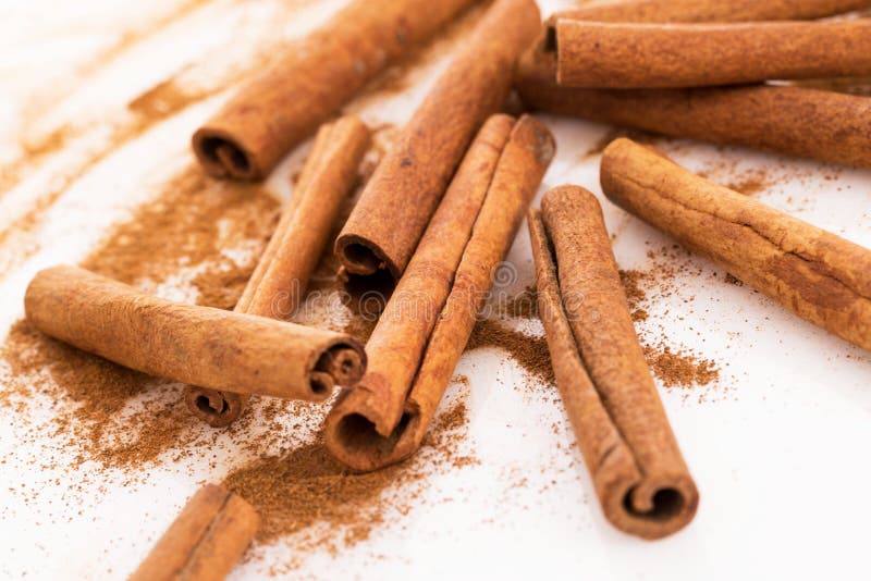 Cinnamon Dust and Sticks in Cup with Cinnamon Leaves Stock Photo ...