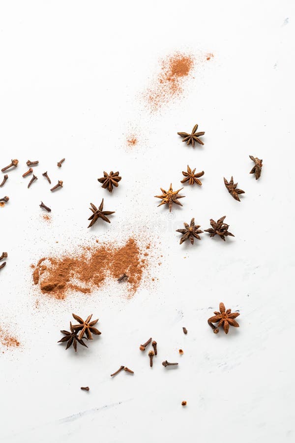 Cinnamon Powder and Anise Star Spice Background on Light Surface Stock ...