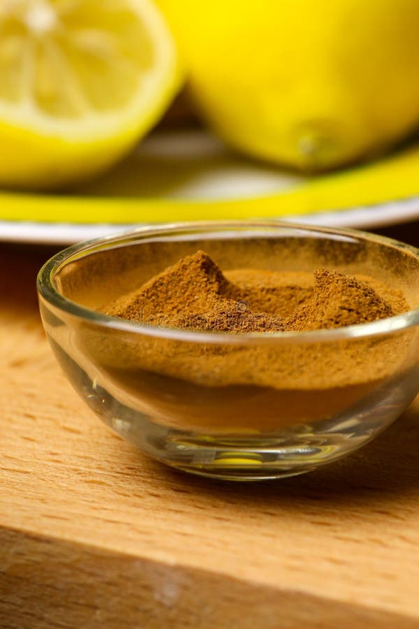 Cinnamon Powder in Front of Lemon Cut Stock Image - Image of close ...