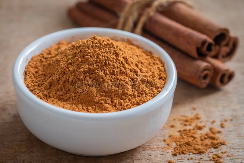 Cinnamon Powder and Cinnamon Sticks on Wooden Table Stock Photo - Image ...