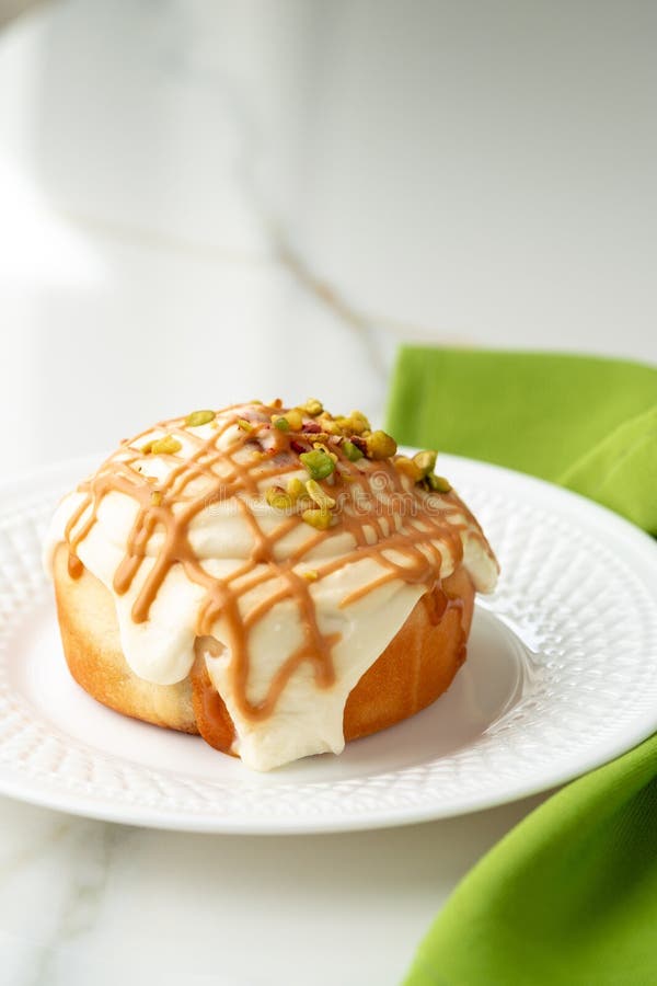 Cinnamon Roll Bun with Icing on Plate Stock Image - Image of swedish ...