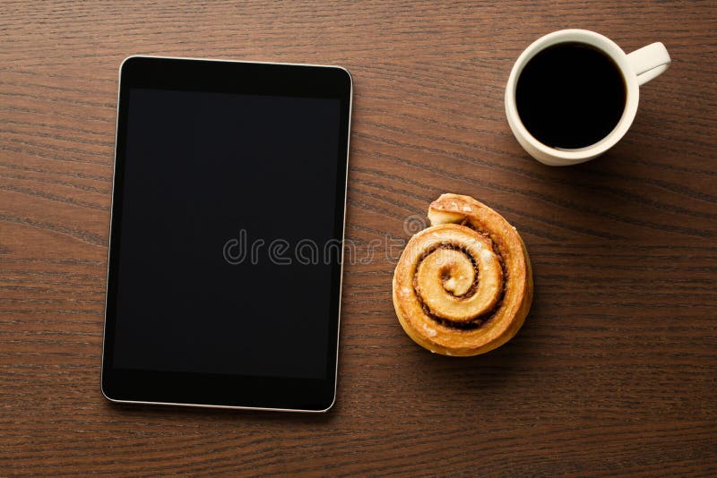 Cinnamon Roll, Cup of Coffee and Computer Tablet Stock Image - Image of ...