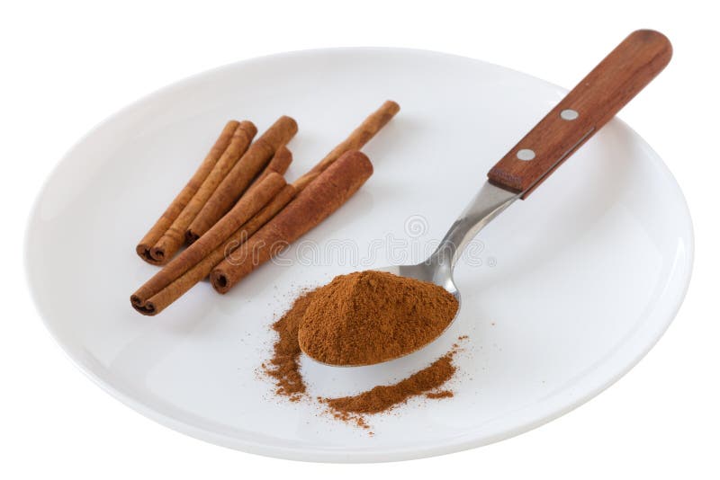 Cinnamon on spoon stock photo. Image of dessert, white - 23360128