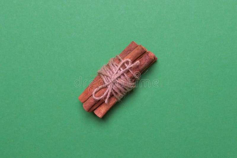 Cinnamon Sticks on Black Colored Paper Background, Top View Stock Photo ...