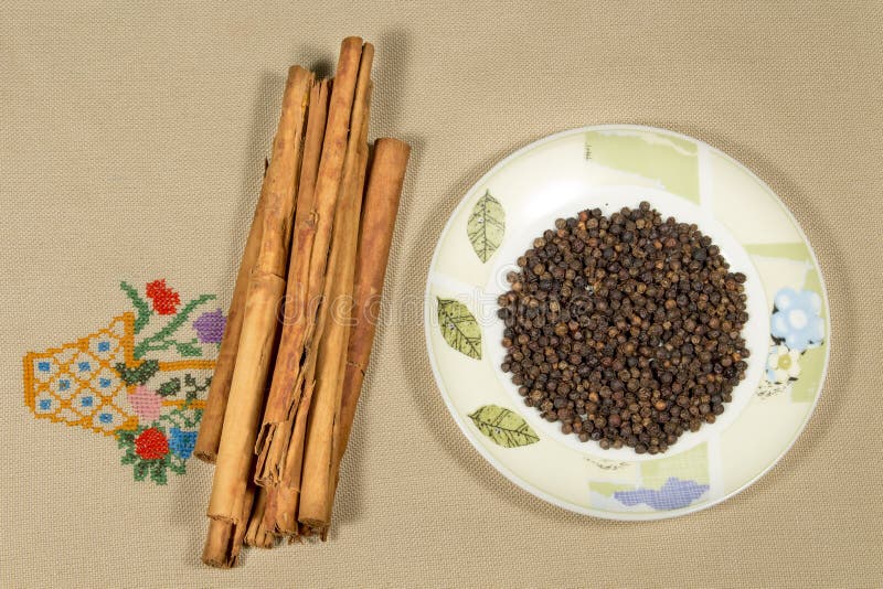Cinnamon Sticks and Black Pepper Grains Stock Photo - Image of sticks ...