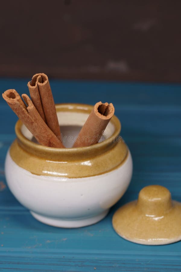 Cinnamon Sticks in a Container on a Blue Background Stock Photo - Image ...