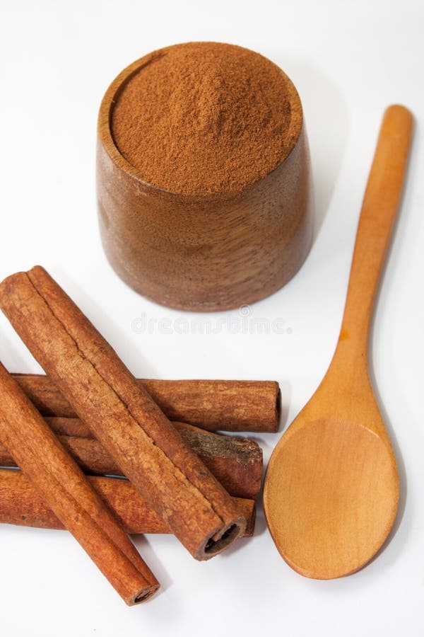 Cinnamon Sticks and Ground Cinnamon on Wooden Plates and Spoon Stock ...