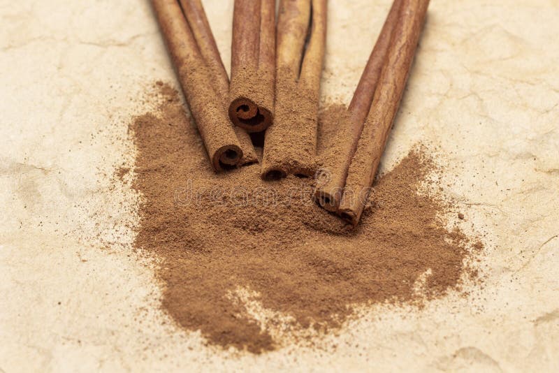 Cinnamon Sticks on Ground Cinnamon. Top View Stock Image - Image of ...